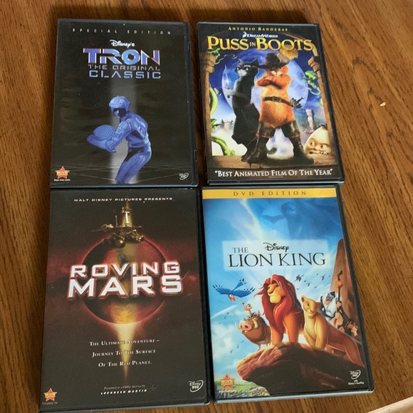 Disney | Media | Disney Dvd Bundle Lion King Tron Puss In Boots Roving ...